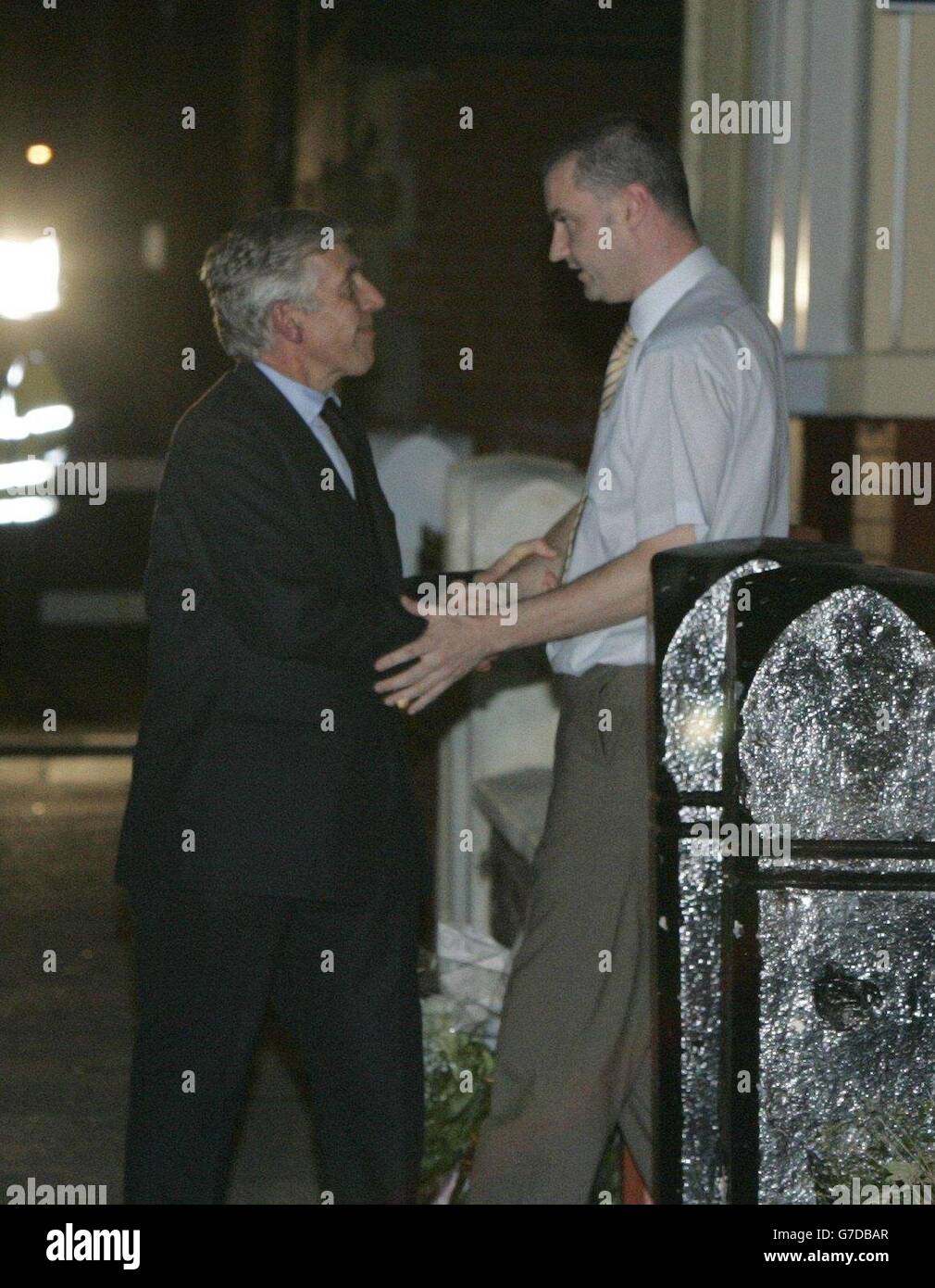 Foreign Secretary Jack Straw shakes the hand of Craig Bigley, Ken ...