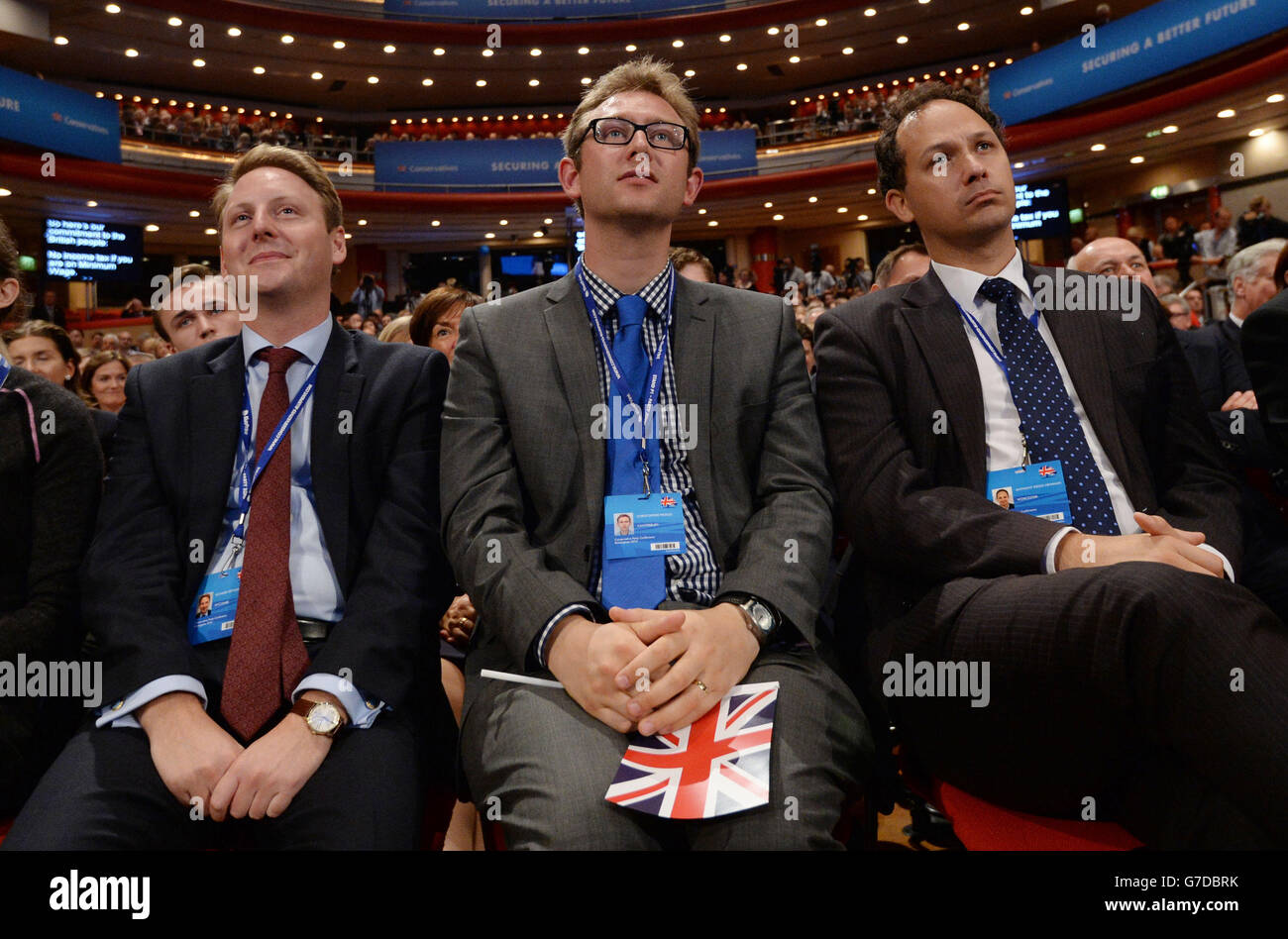 Conservative Party members watch Prime Minister David Cameron deliver ...