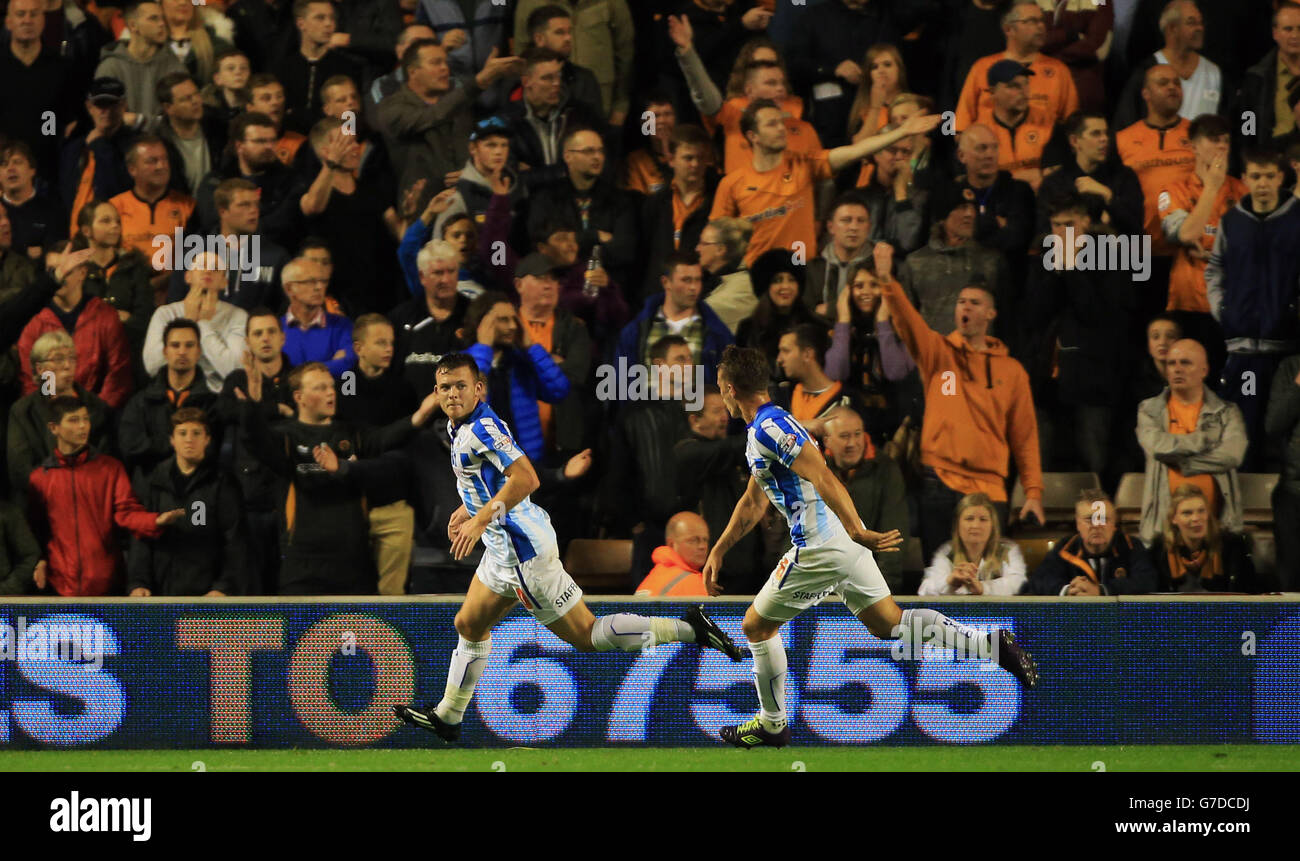 Huddersfield Town's Harry Bunn (left) celebrates scoring his sides ...