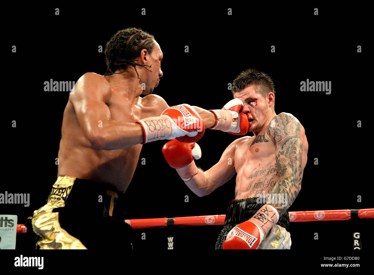 Dave Ryan (right) takes a punch from Tyrone Nurse during the ...