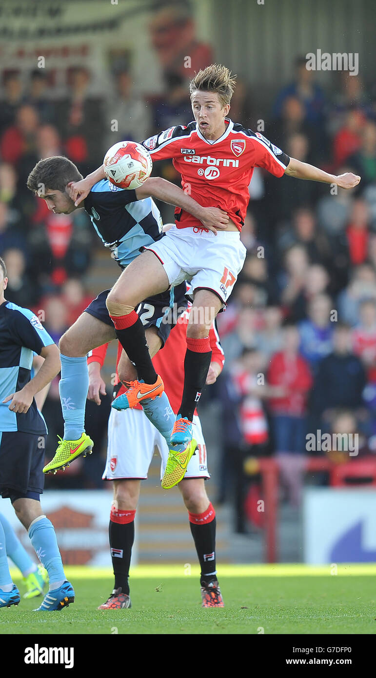 Morecambe's Andrew Fleming (right) and Morecambe's Andy Parrish battle ...