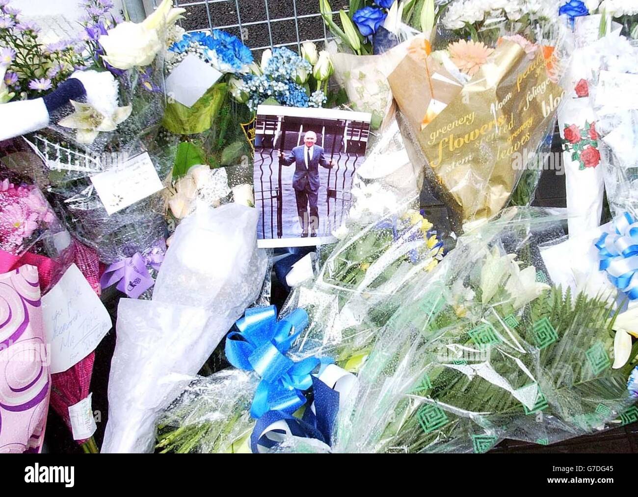 A well wisher inspects tributes to legendary Tottenham Hotspur manager ...