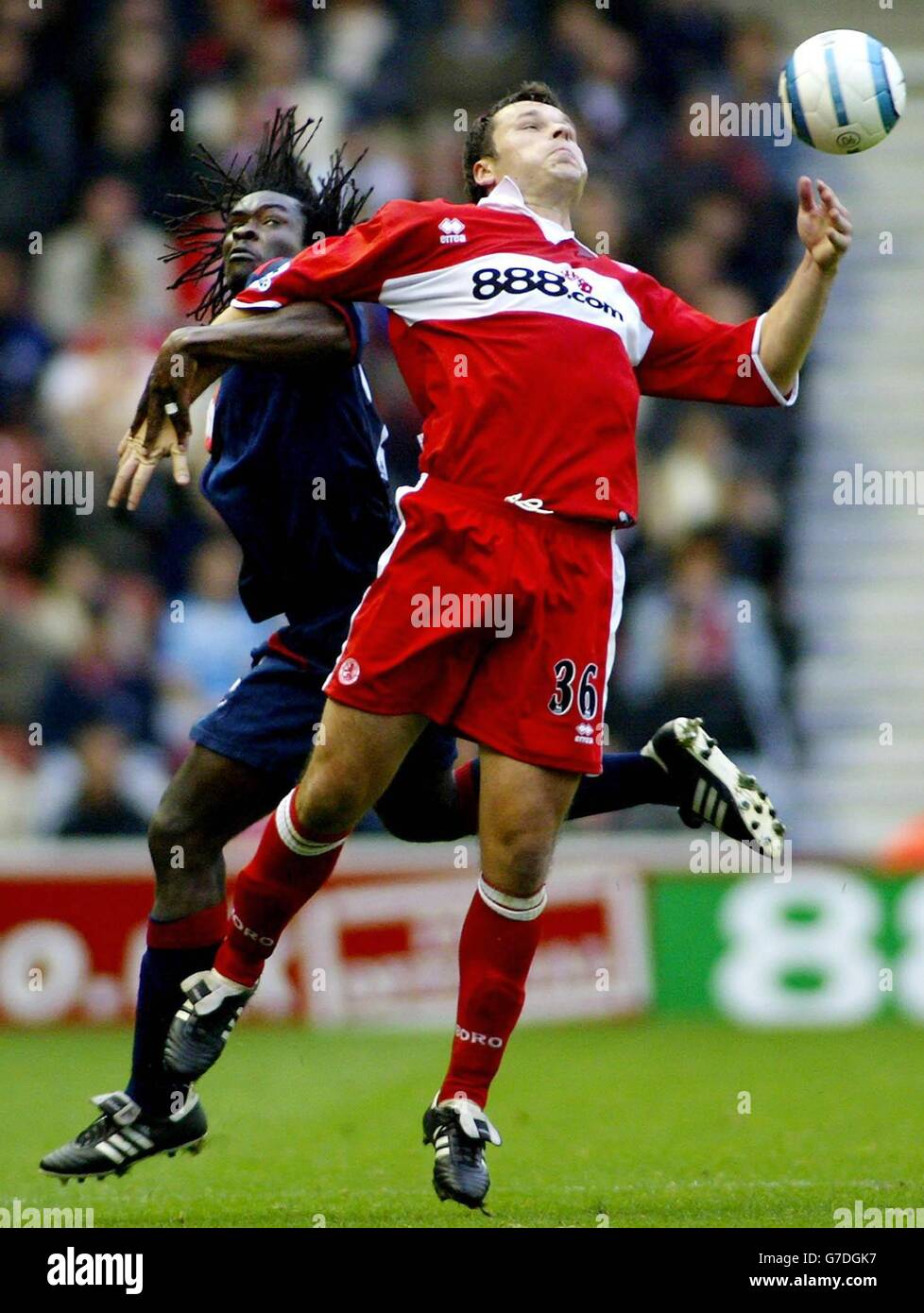 Middlesbrough's Mark Viduka wins the ball from Portmouth's Linvoy ...