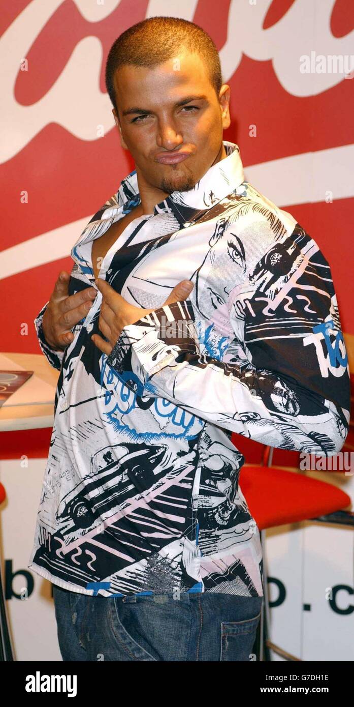 Singer Peter Andre poses for photographers during a photocall at his ...