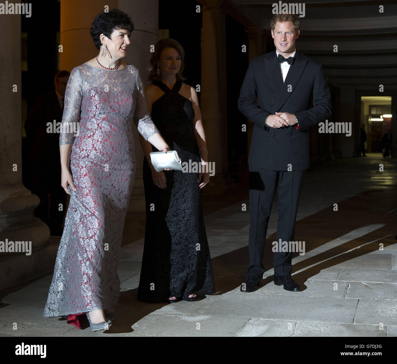 Prince Harry, is greeted by Mimi Drake (centre) the Chair of the 100 ...