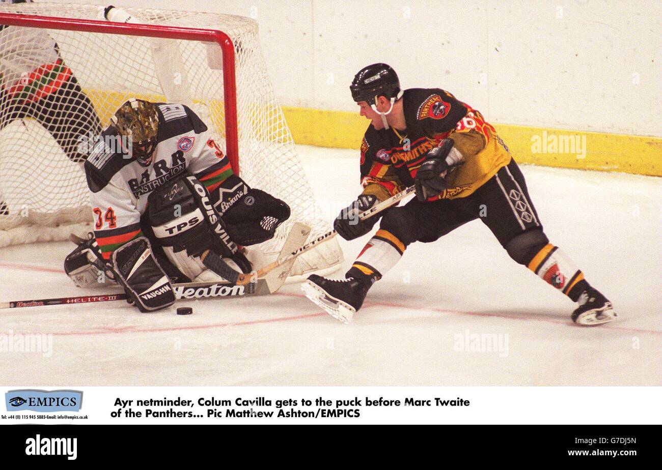 Ayr netminder, Colum Cavilla gets to the puck before Marc Twaite of the ...