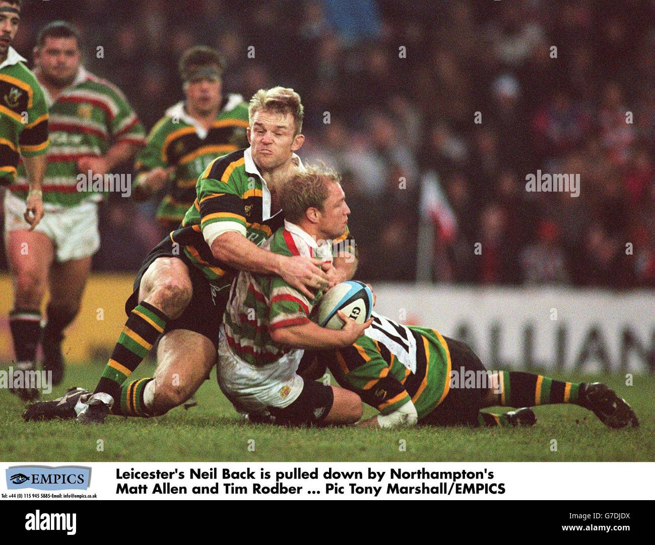 RUGBY - Leicester v Northampton. Leicester's Neil Back is pulled down ...