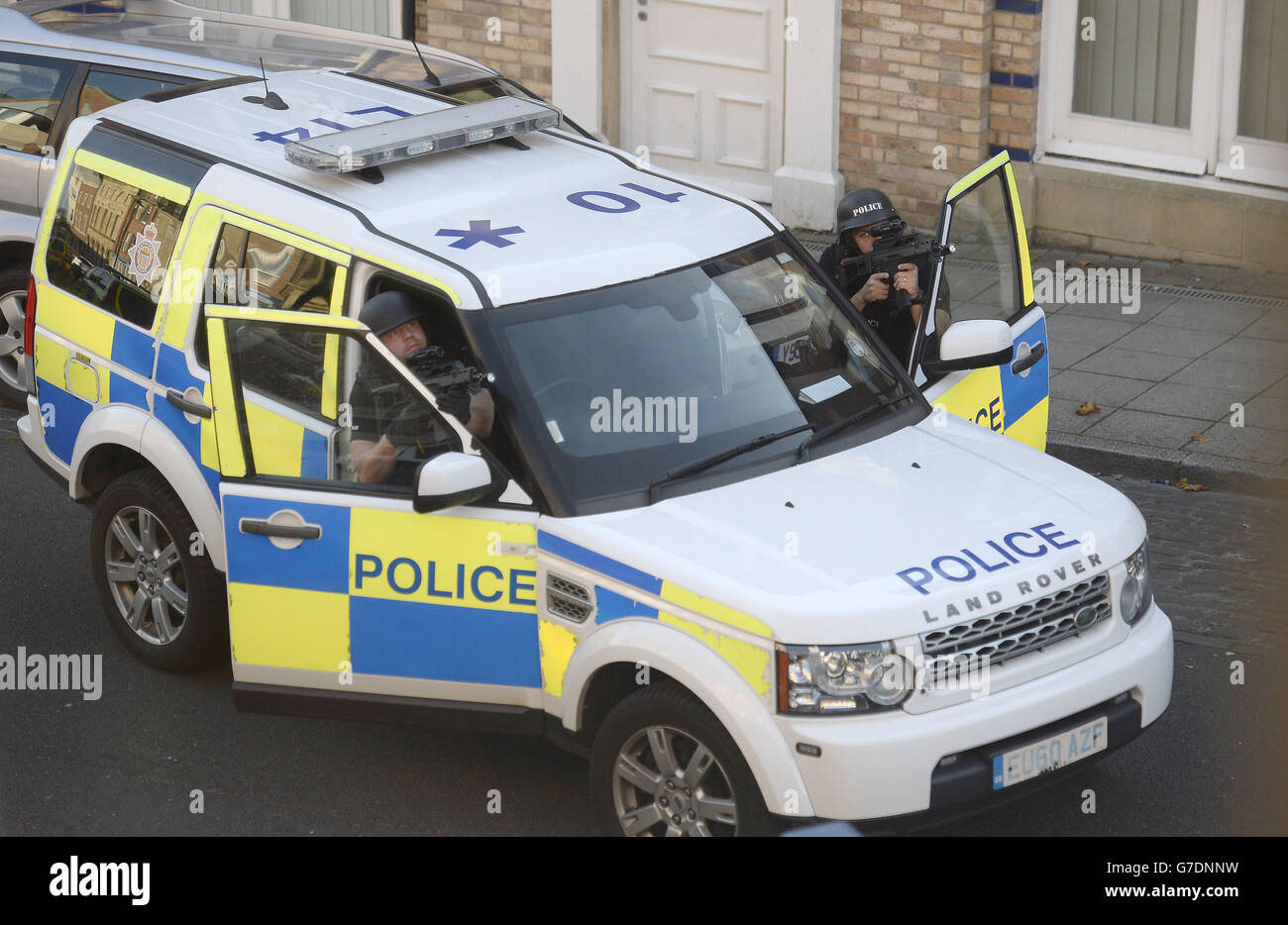 Armed police in stand-off Stock Photo - Alamy
