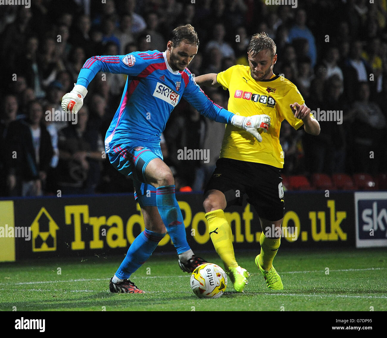 Brentford's goalkeeper David Button (left) and Watford's Joel Ekstrand ...