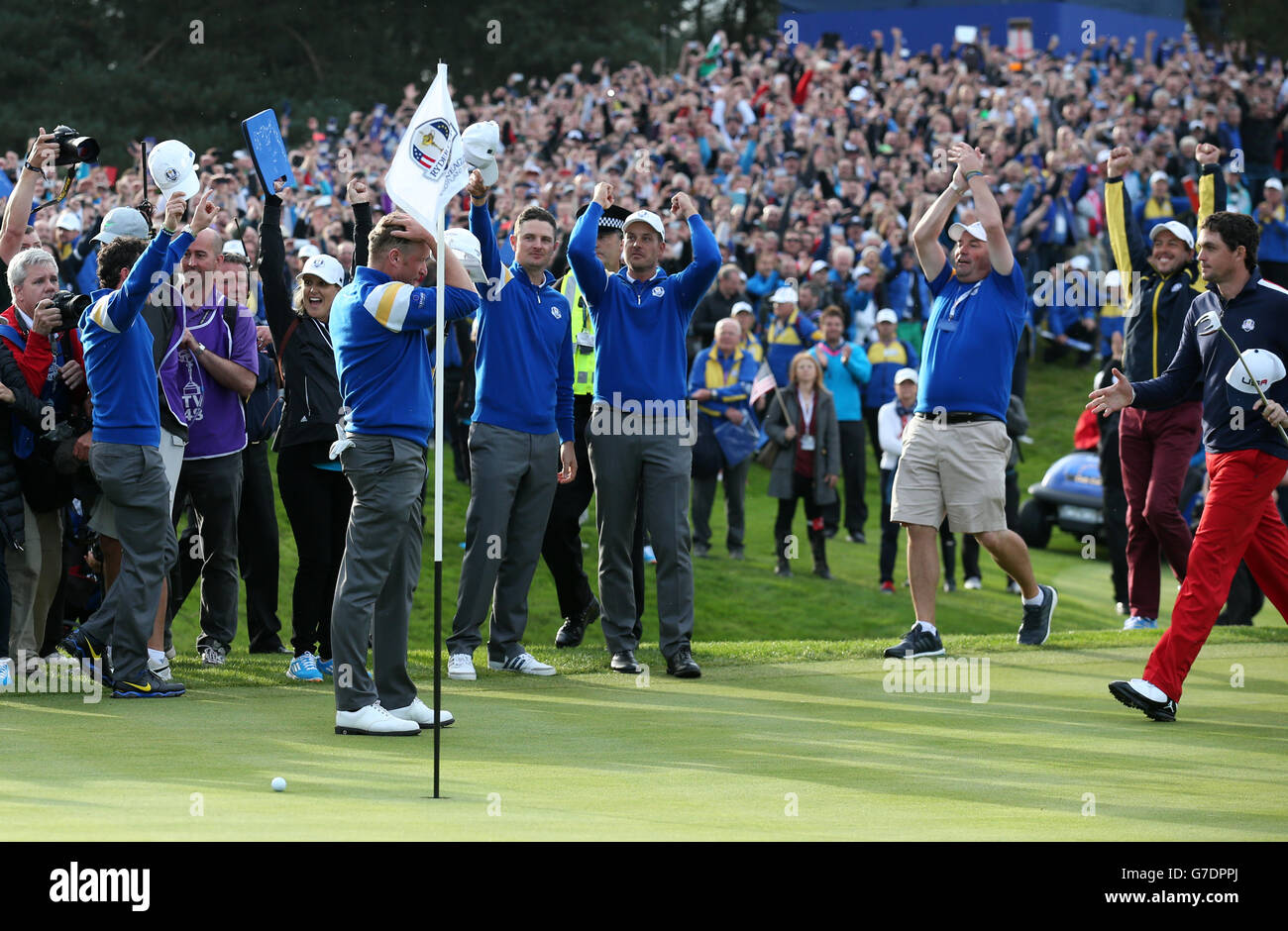 European players including Jamie Donaldson(C) celebrate as USA Keegan ...