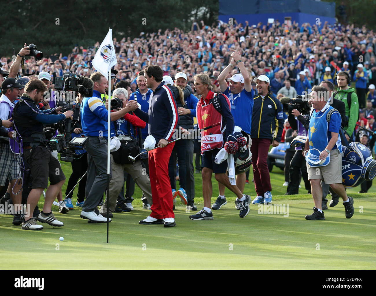European players including Jamie Donaldson(C) celebrate as USA Keegan ...