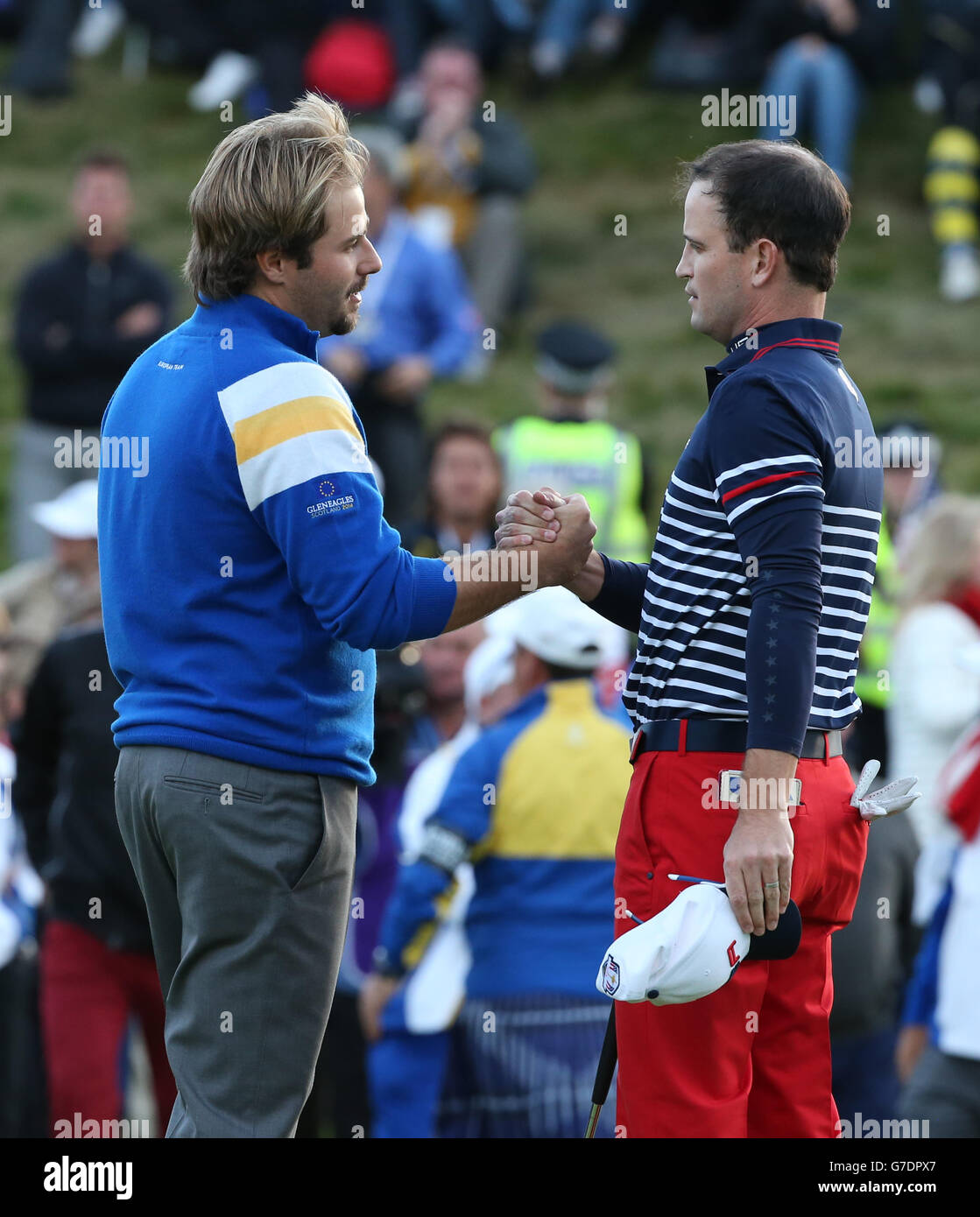 European player Victor Dubuisson is congratulated by Zach Johnson after ...