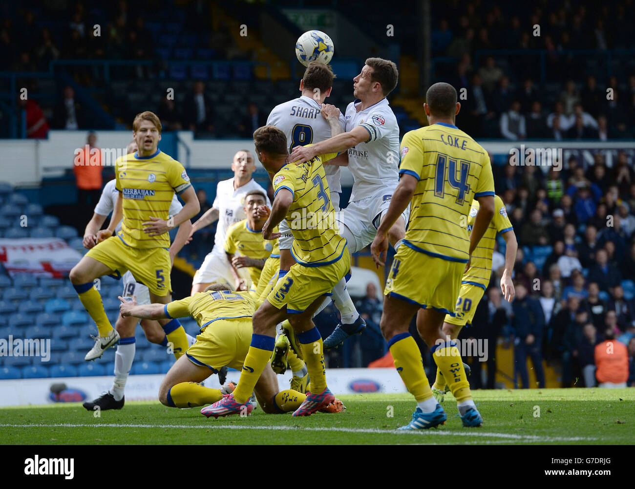 Leeds United's Billy Sharp and Jason Pearce collide as they both try to ...