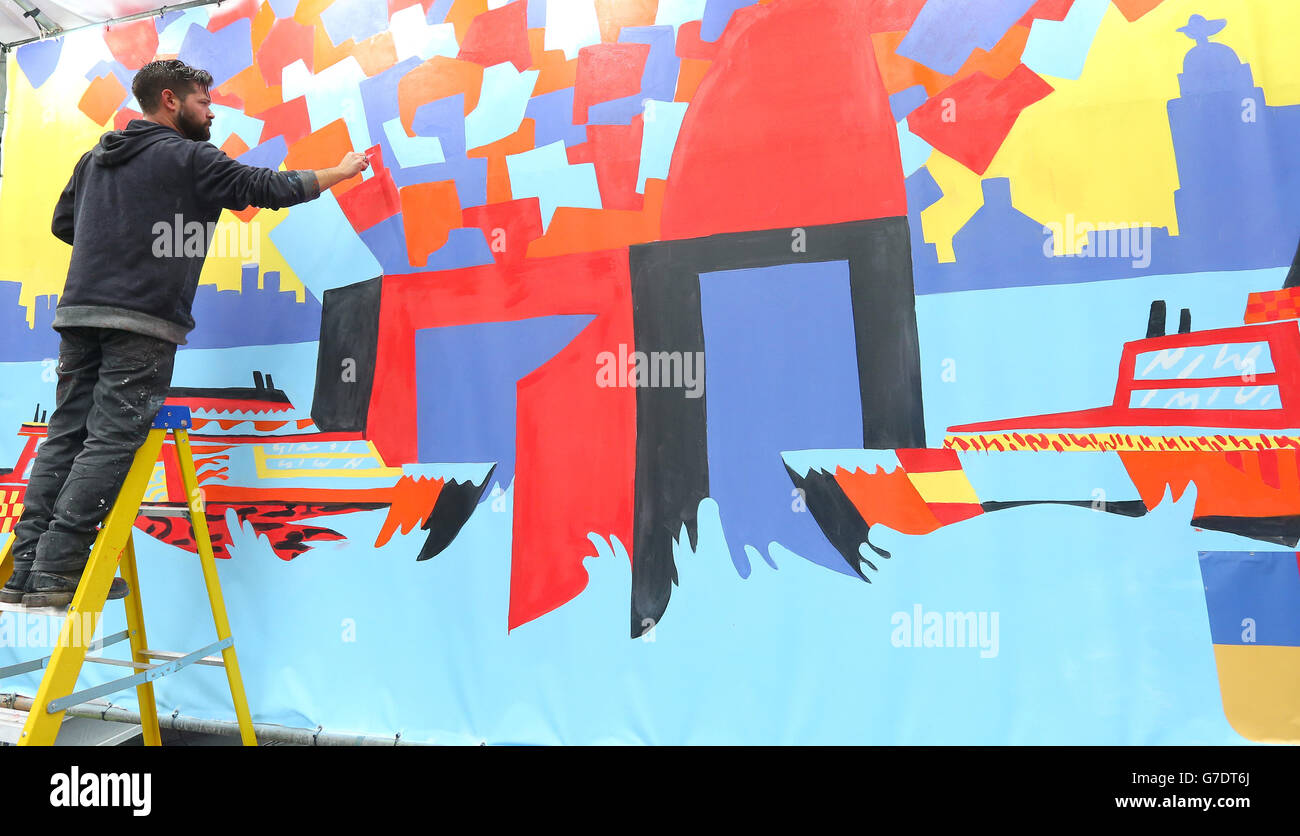 EDITORIAL USE ONLY Muralist Peter Barber puts the finishing touches to ...