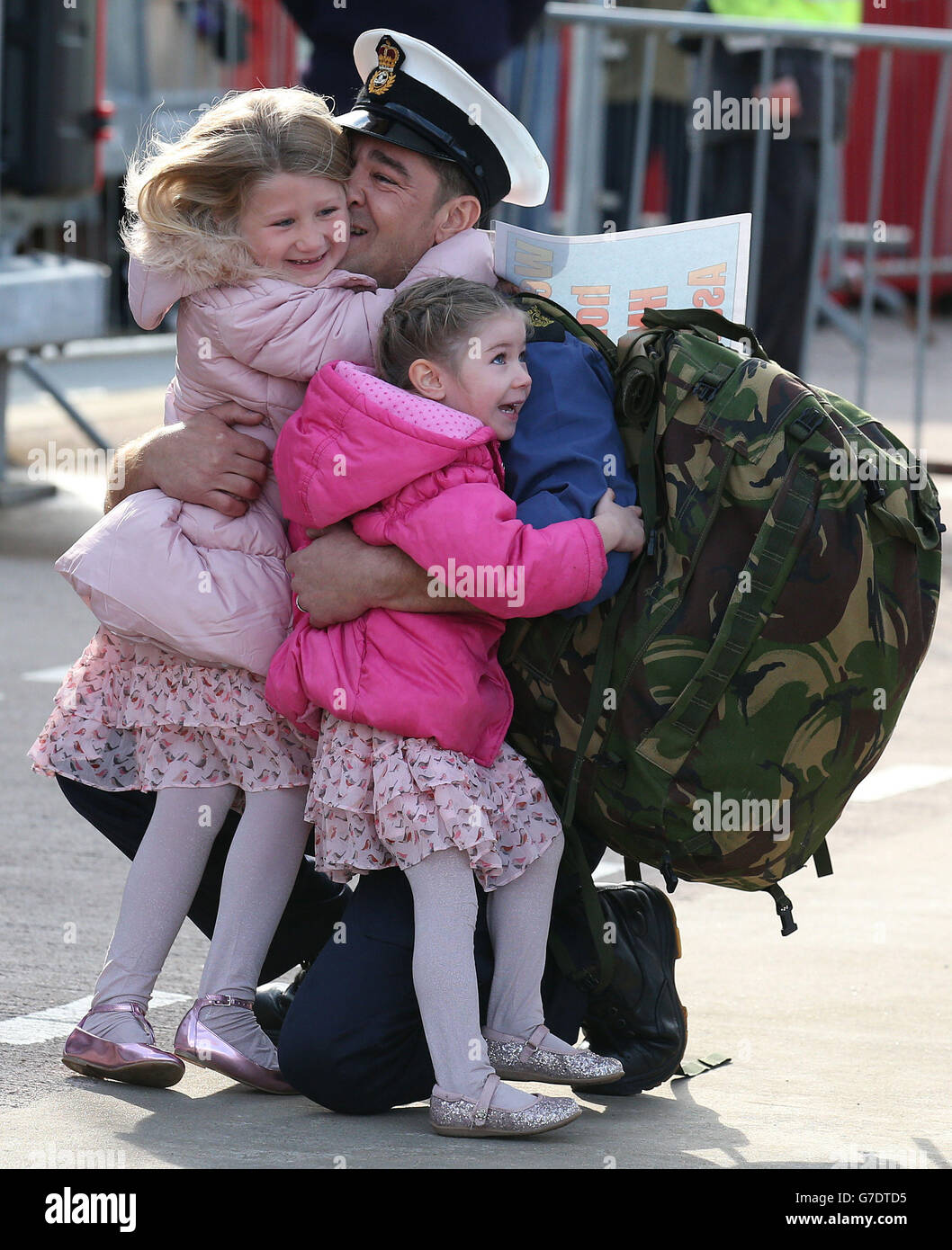 Submariner Tony Simpson from Helensburgh hugs children Iyla, 7, (left ...