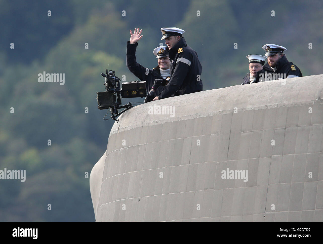 Submariners wave from HMS Astute on it's return to HM Naval Base Clyde ...