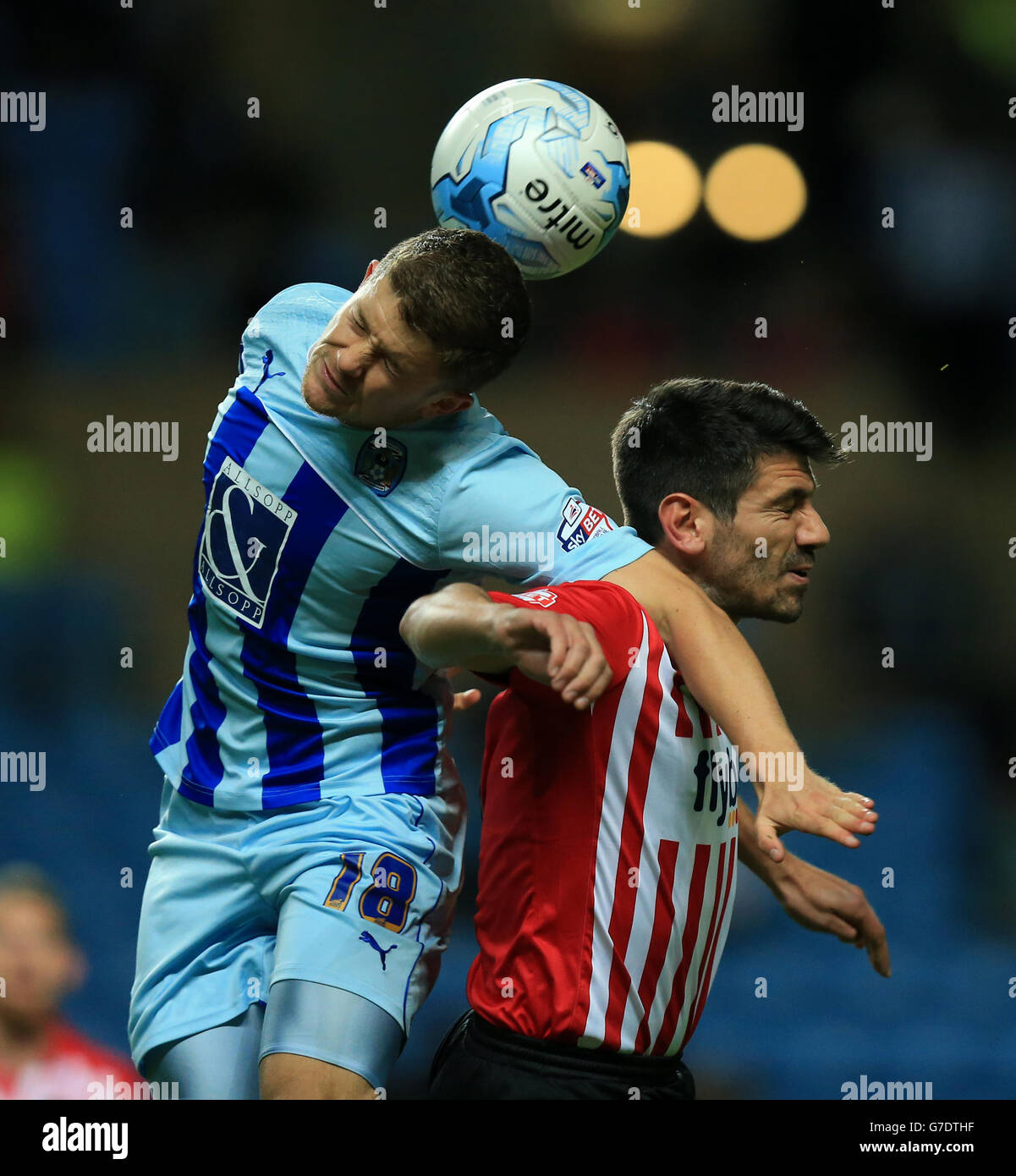 Coventry City's Aaron Phillips and Exeter City's Danny Butterfield ...