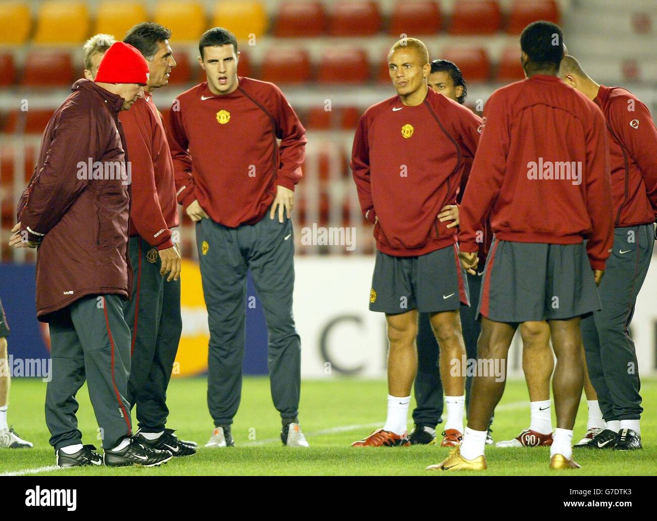 Manchester United's Wes Brown and John O' Shea listen to Sir Alex ...