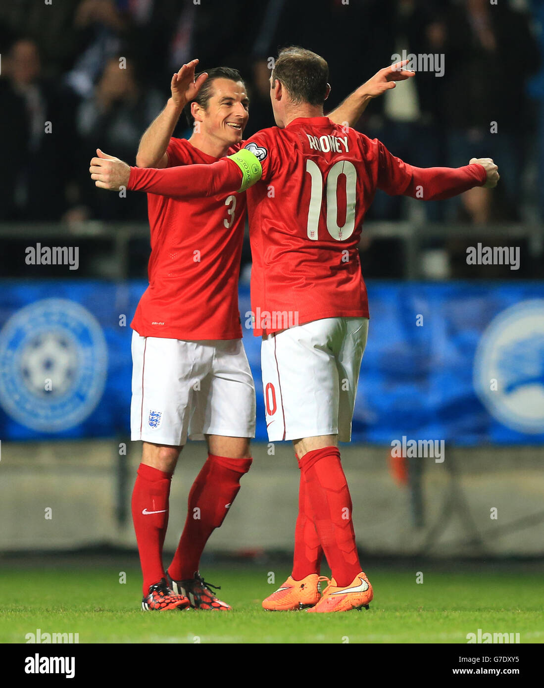 England's Wayne Rooney (right) celerates scoring his sides first goal ...