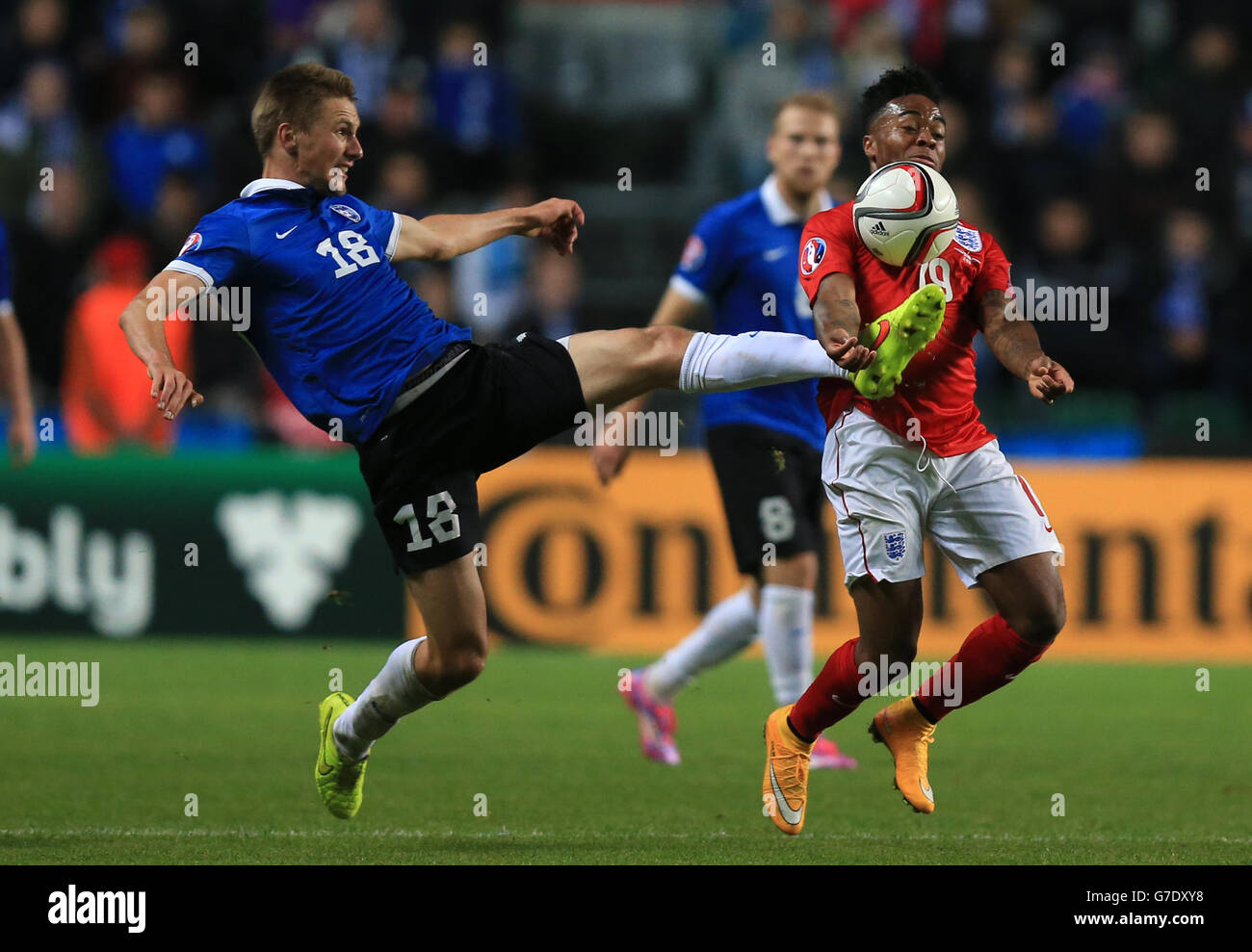 England's Raheem Sterling (right) and Estonia's Karol Mets battle for ...