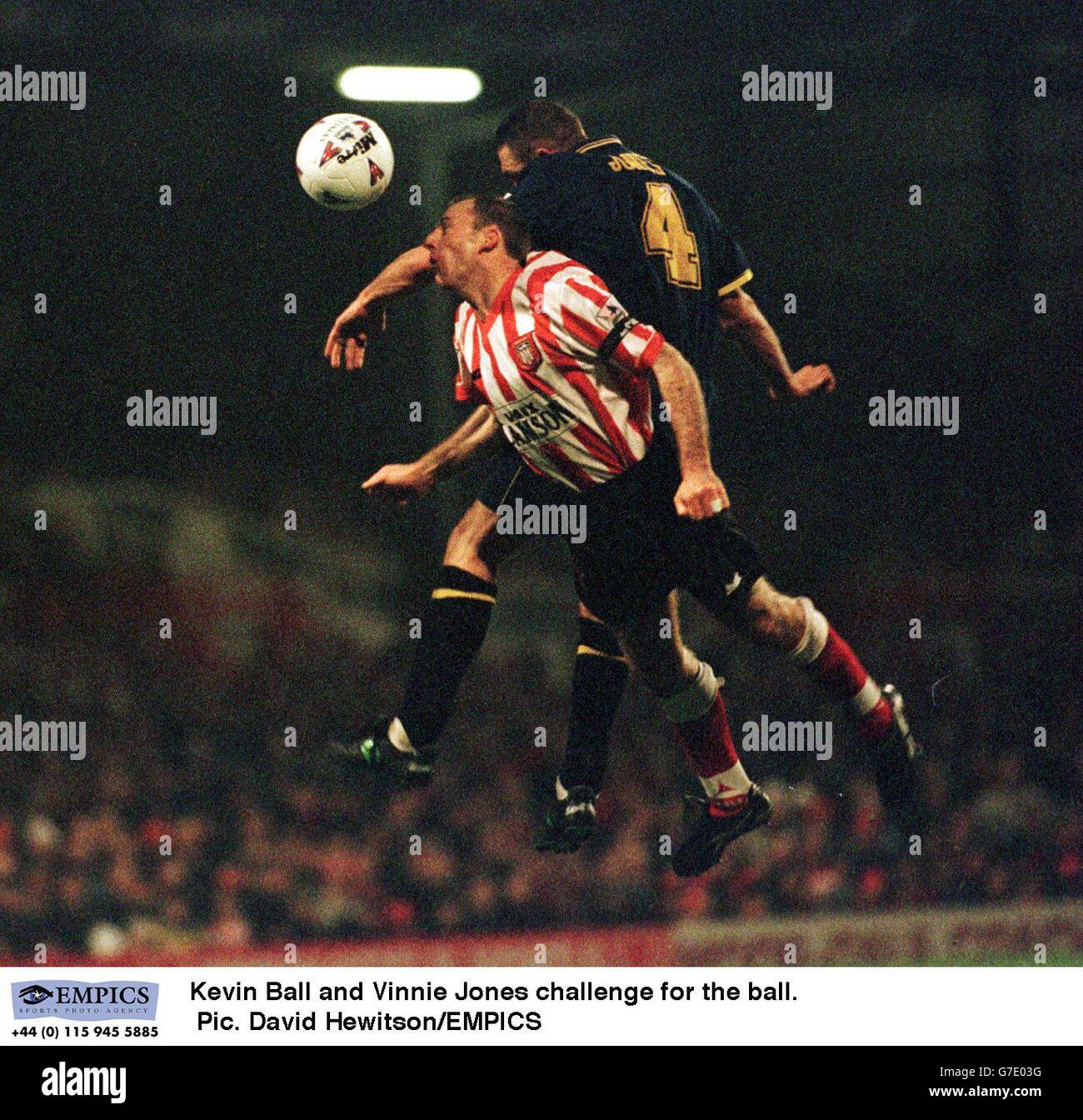 Kevin ball and vinnie jones challenge for the ball hi-res stock ...