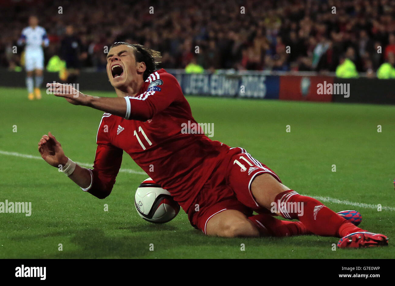 Wales' Gareth Bale is fouled on the edge of the penalty area and gains ...