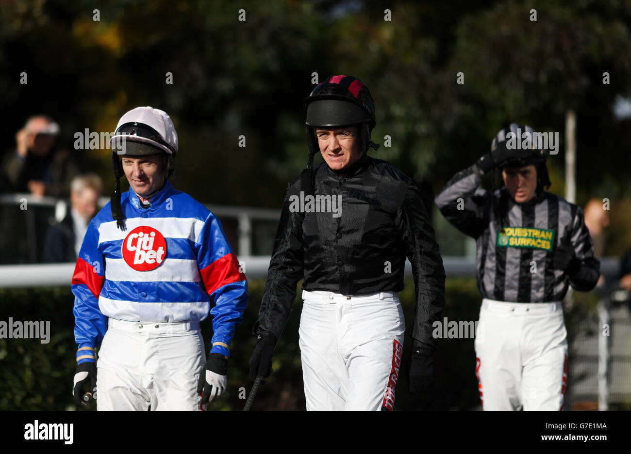 Barry Geraghty (centre) walks into the parade ring alongside fellow ...