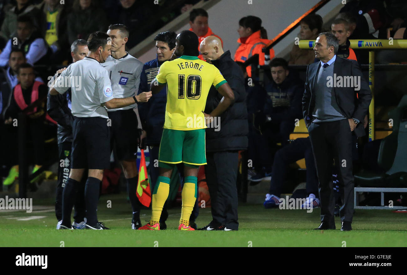 Referee Mark Clattenburg speaks to Managers following an altercation ...