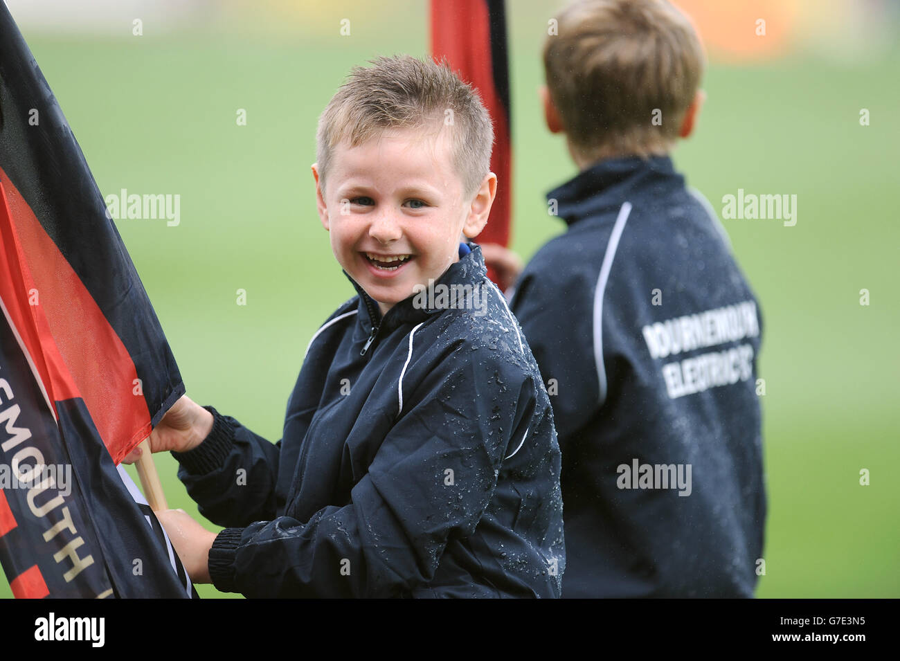 Bournemouth mascots forming the guard of honour get sprayed by the ...