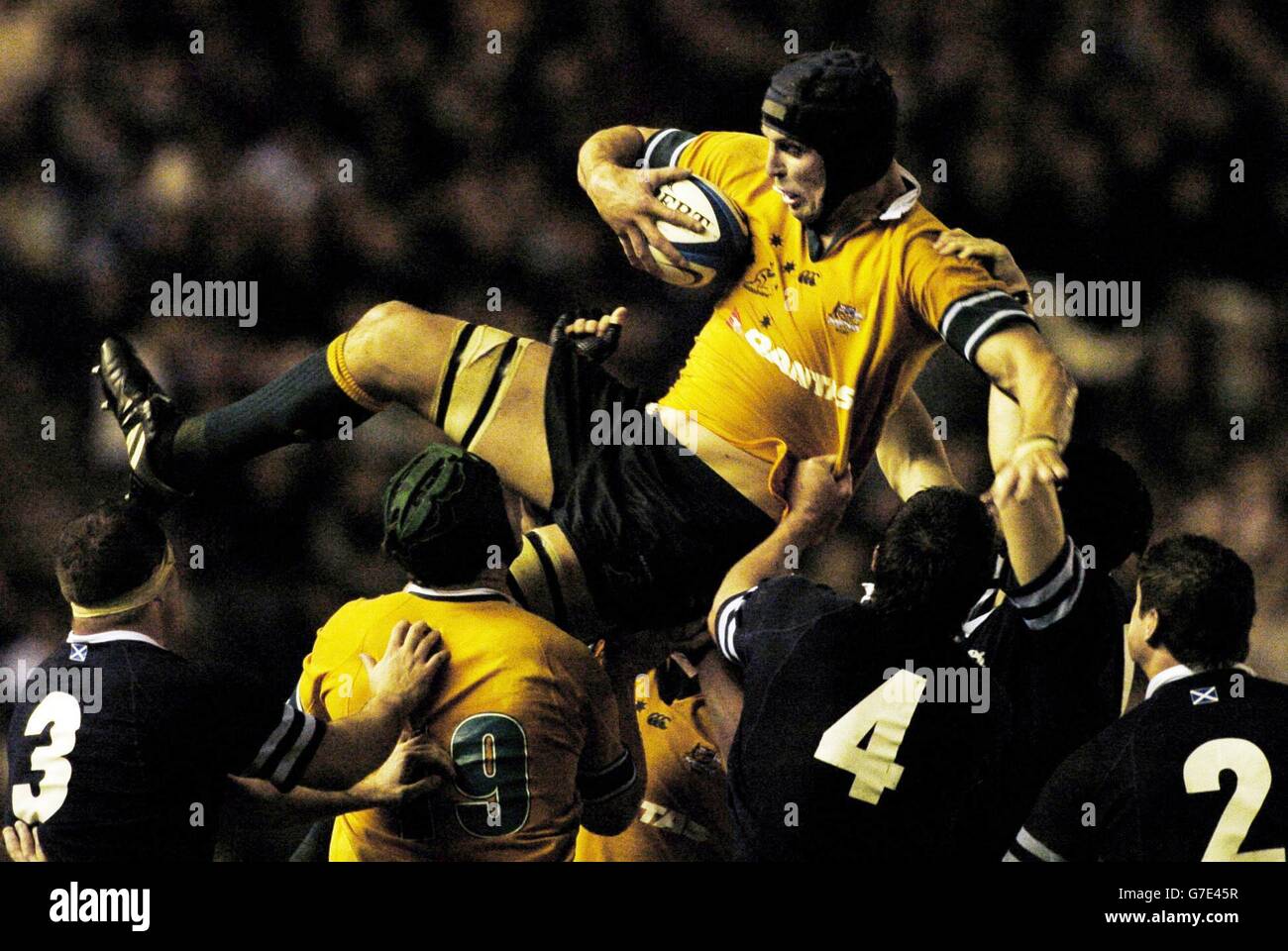 Australia`s Daniel Vickerman holds off Scotland during the ...