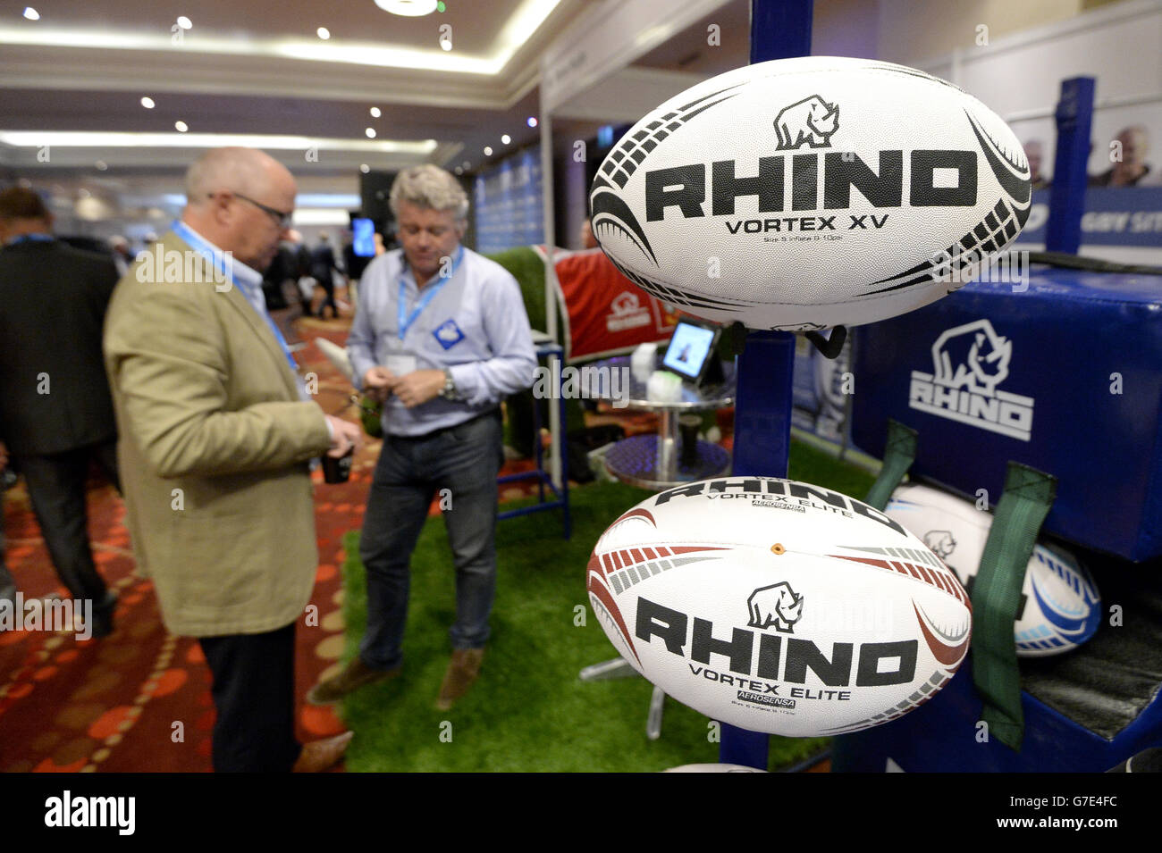 Guests explore the rhino rugby stand at rugby expo 2014 hi-res stock ...