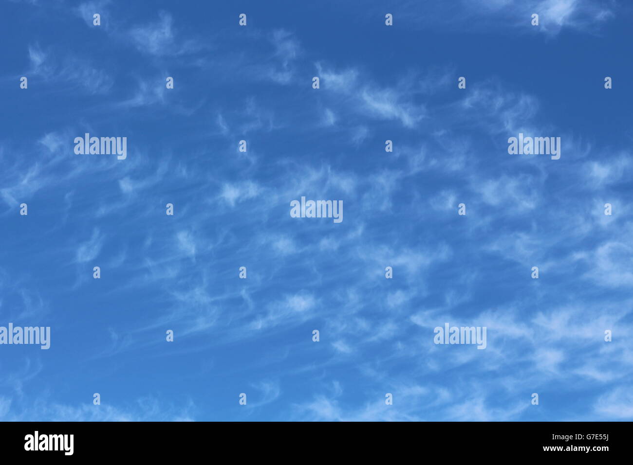 Whispy cirrus cloud formation against a blue sky background Stock Photo ...