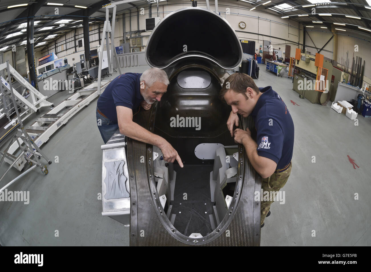 Engineers work on the carbon fiber aor intake and cockpit section on ...