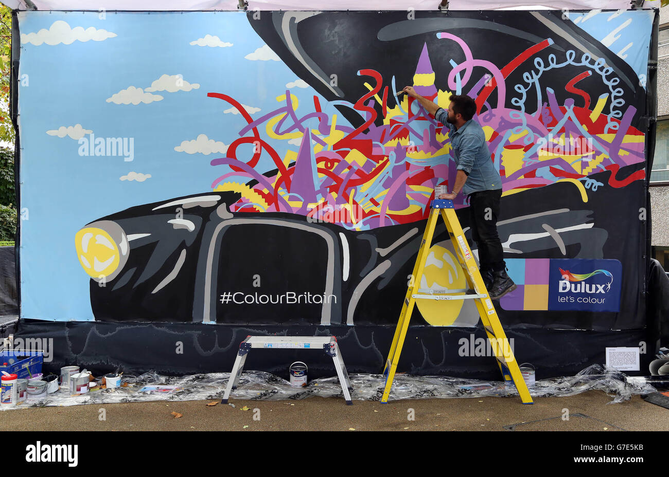 EDITORIAL USE ONLY Muralist Peter Barber puts the finishing touches to ...