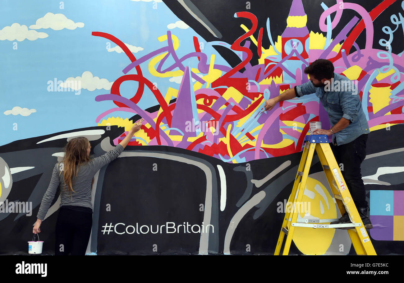 Muralist Peter Barber and his daughter Forest put the finishing touches ...