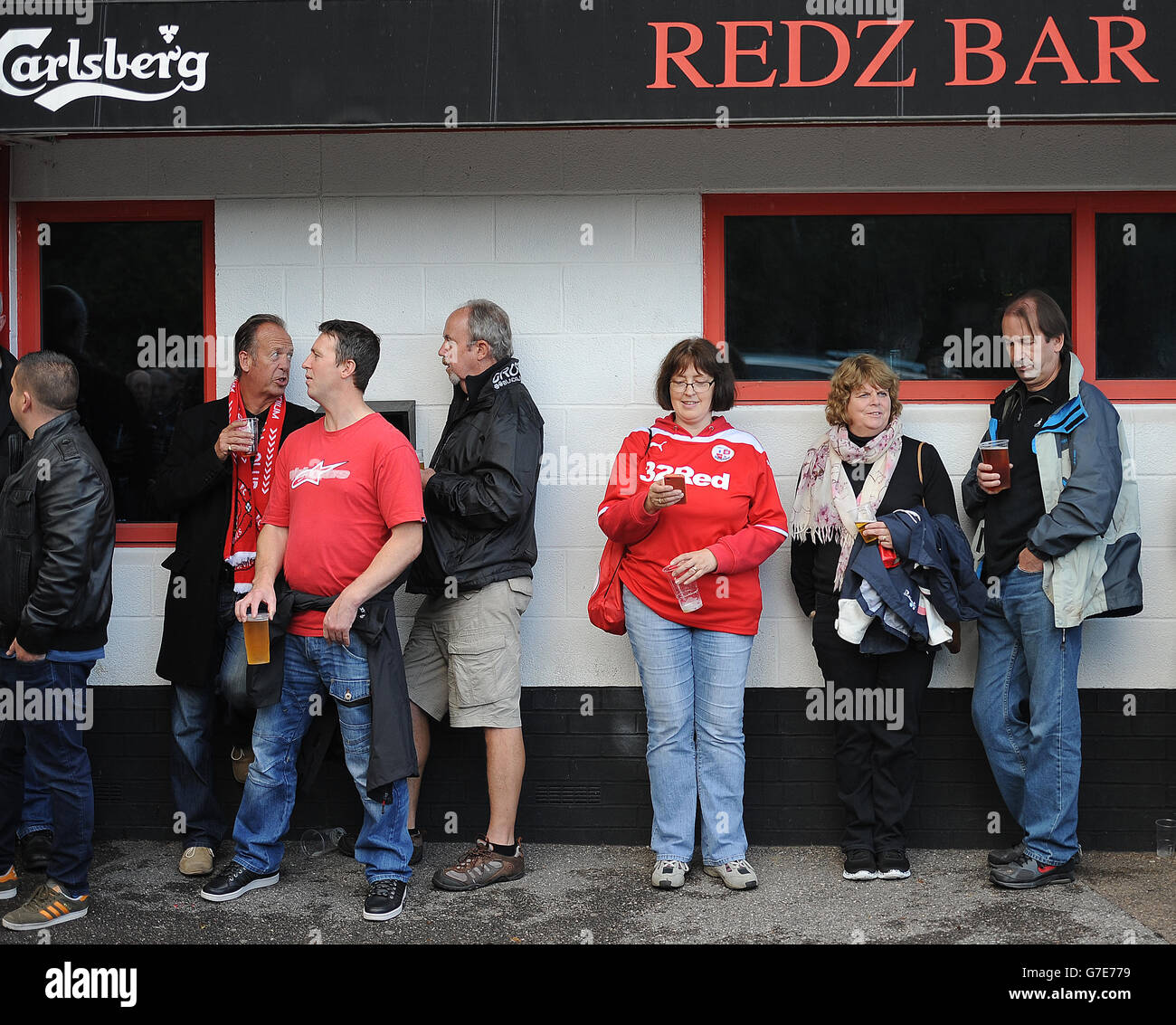 Crawley Town fans stand outside the Redz Bar at the Checkatrade.com ...