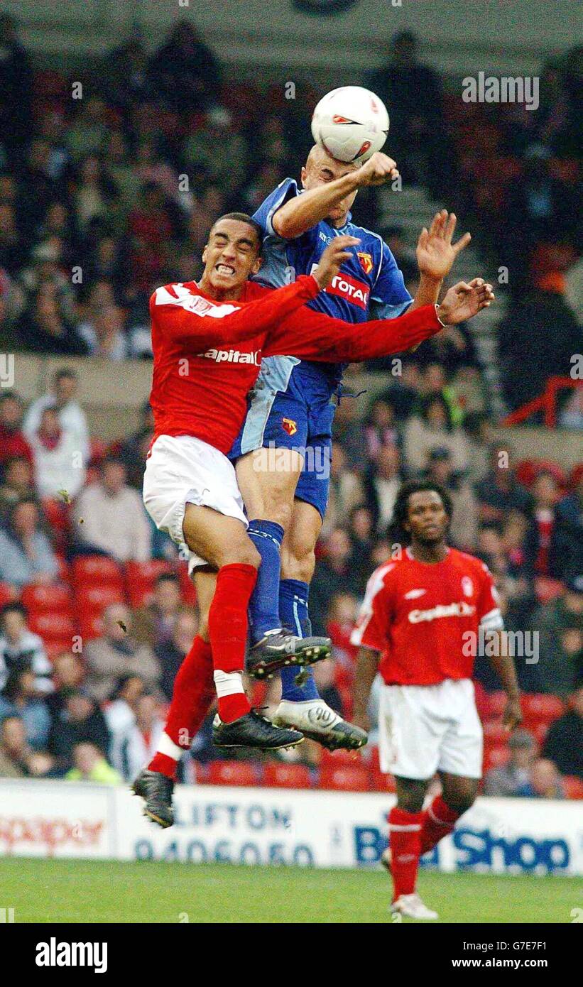 Nottingham Forest's James Perch (L) challenges Watford's Gavin Mahon ...