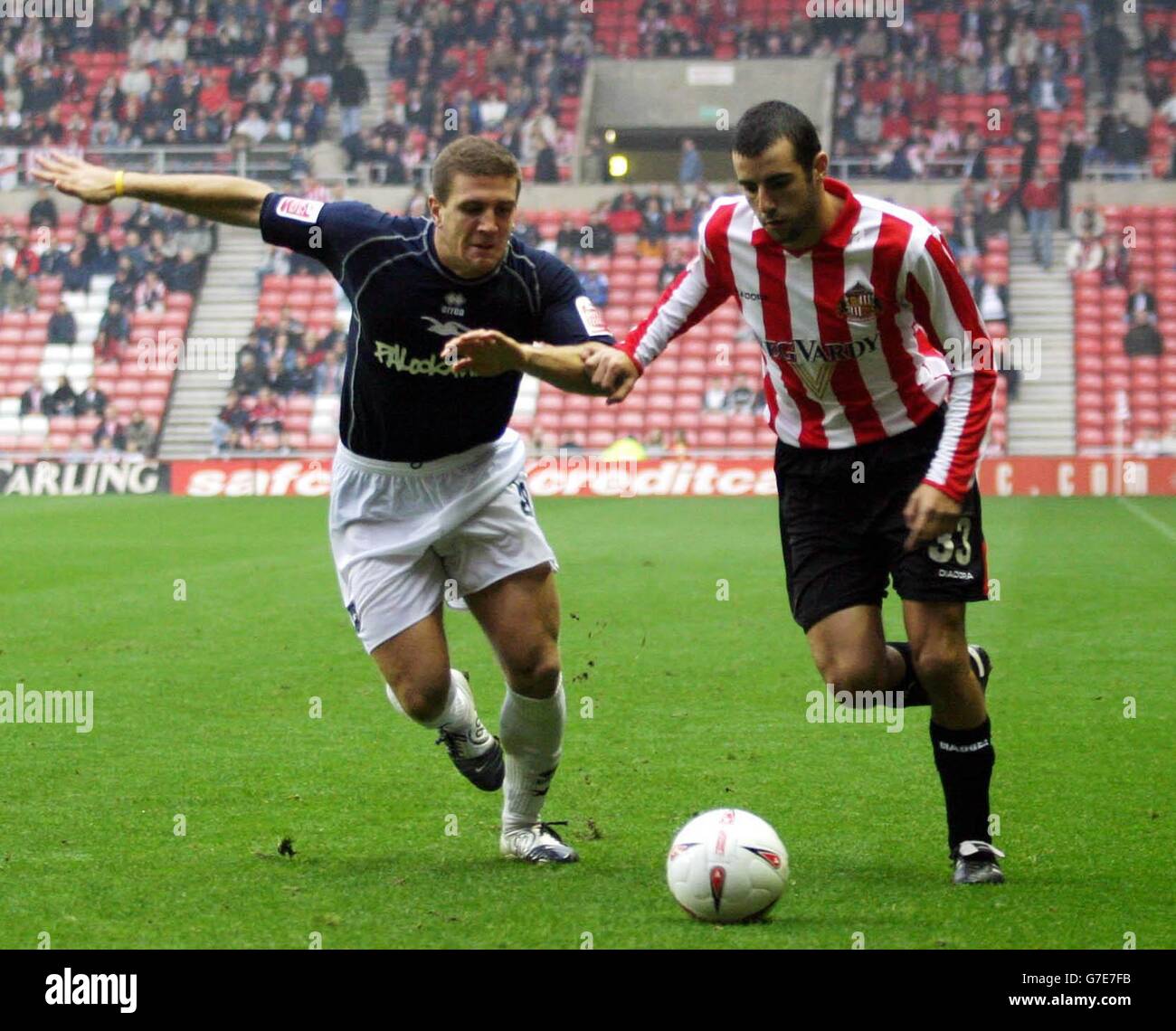 Sunderland's Julio Arca (R) is challenged by Brighton's Adam El-Abd ...
