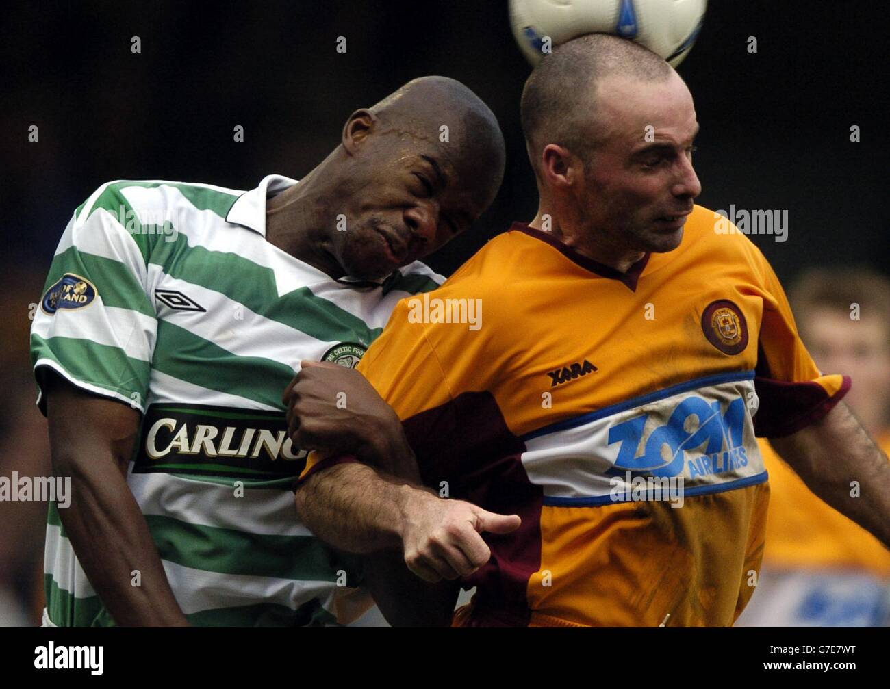 Celtic's Bobo Balde (left) challenges Motherwell's Alex Burns during ...