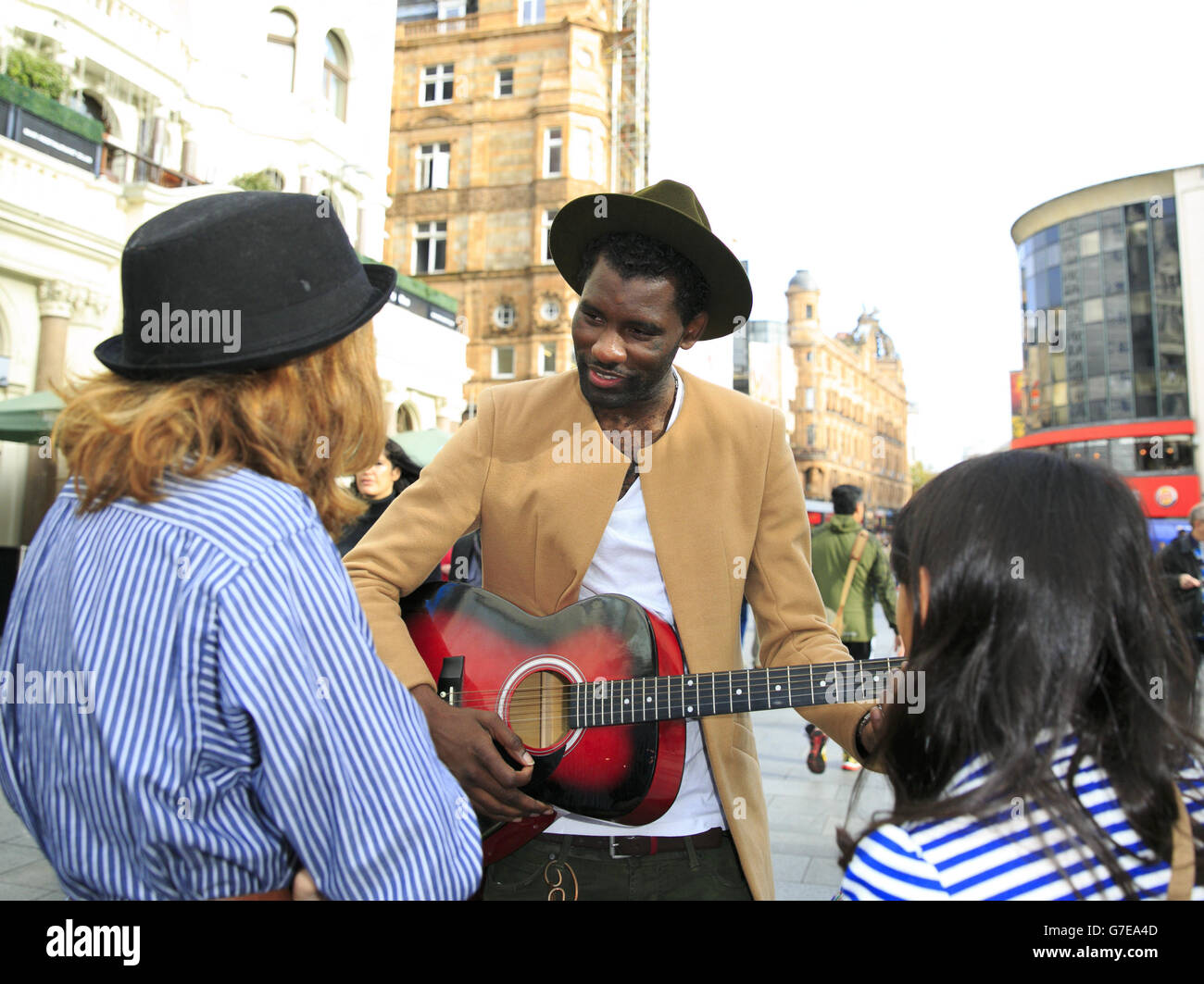 EDITORIAL USE ONLY Grime artist Wretch 32 poses with Rhiannon Sharkey ...