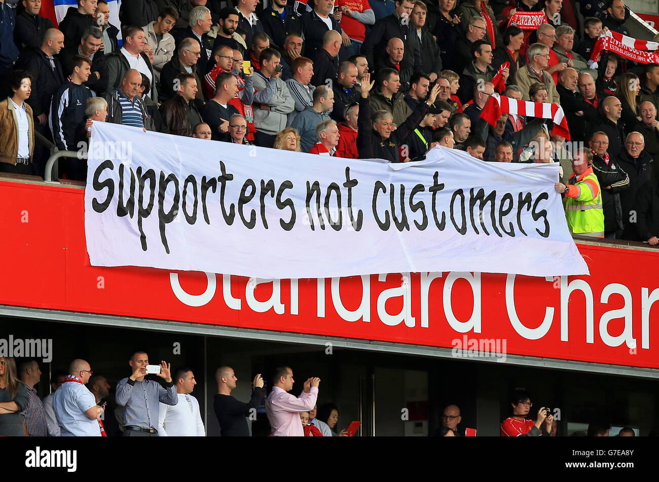Liverpool fans protest with banners about ticket prices before the ...