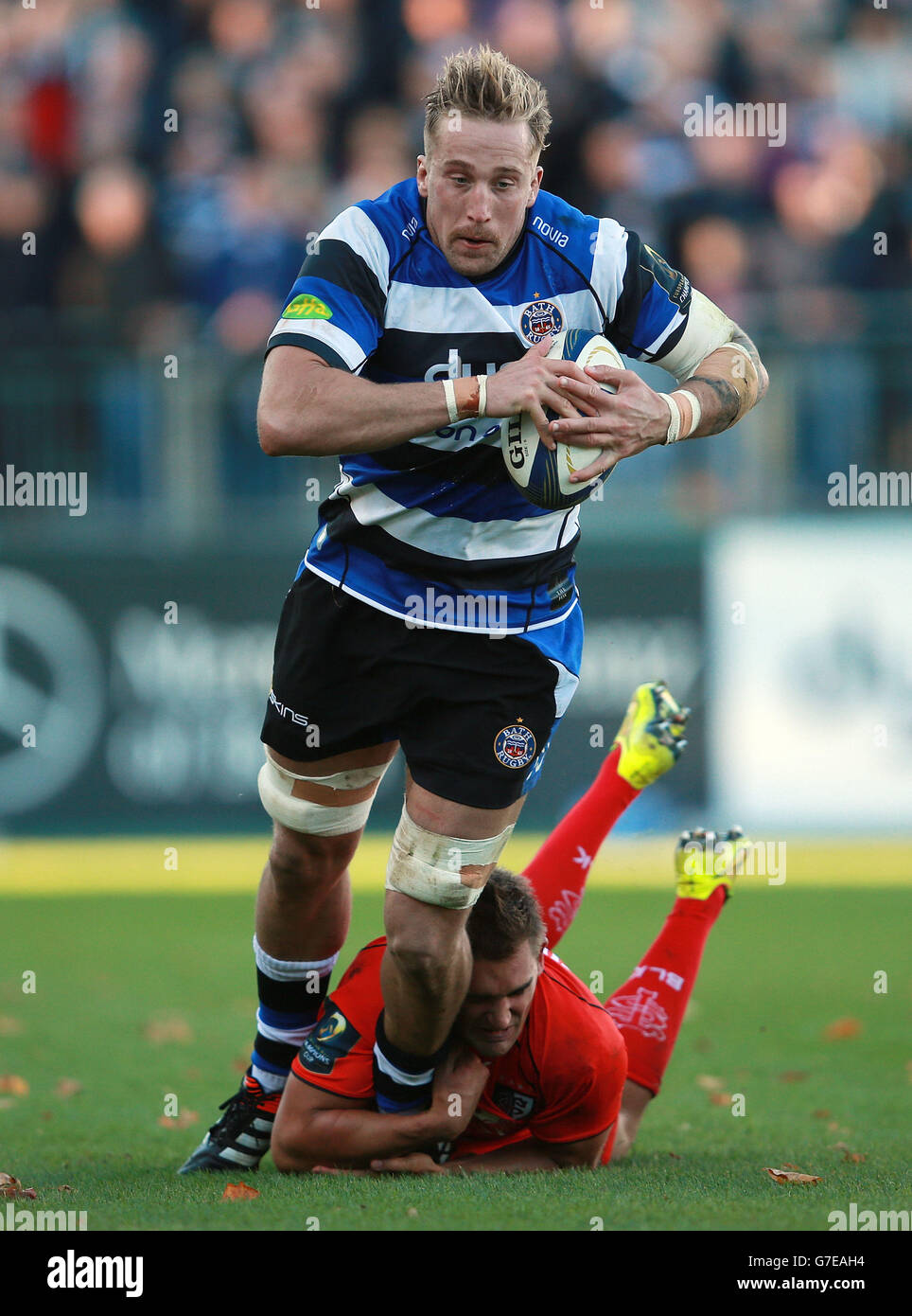 Bath's Dominic Day is tackled by Toulouse's Toby Flood during the ...
