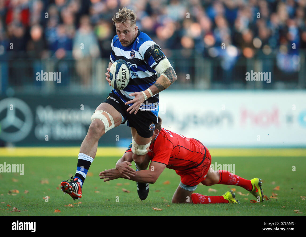 Bath's Dominic Day is tackled by Toulouse's Toby Flood during the ...
