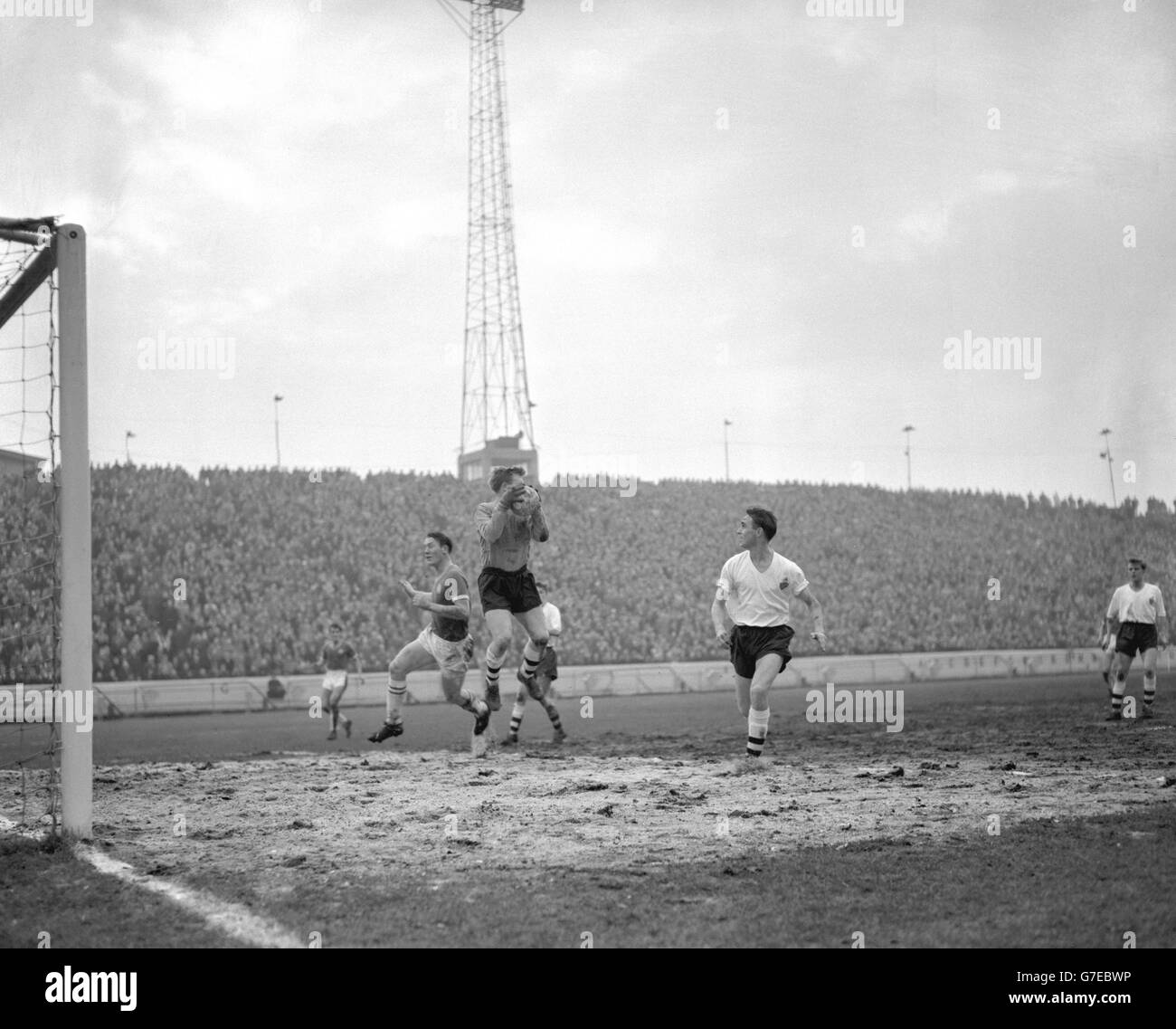 Bolton Wanderers goalkeeper Eddie Hopkinson jumps to take the ball from ...