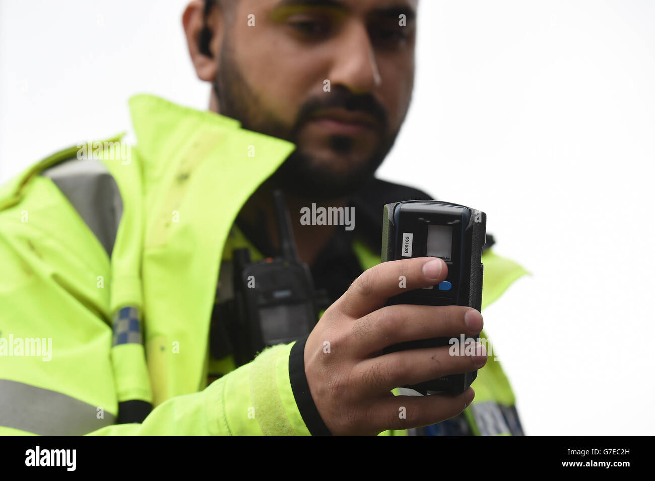 Police officer drivers fingerprints on mobile identification device hi ...