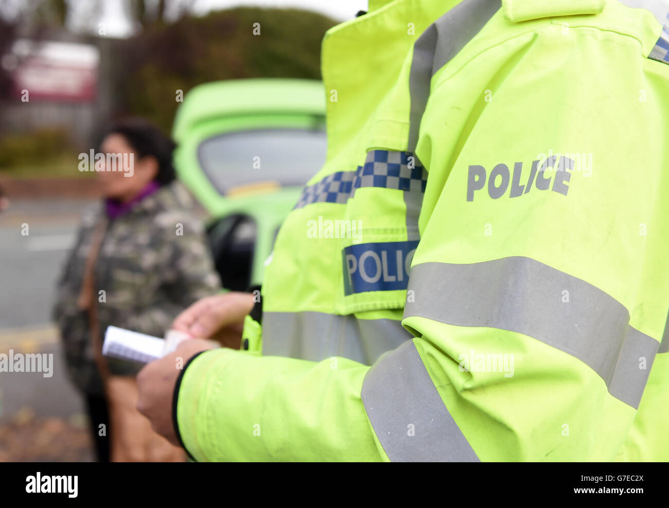 Police officer drivers details on mobile identification device hi-res ...