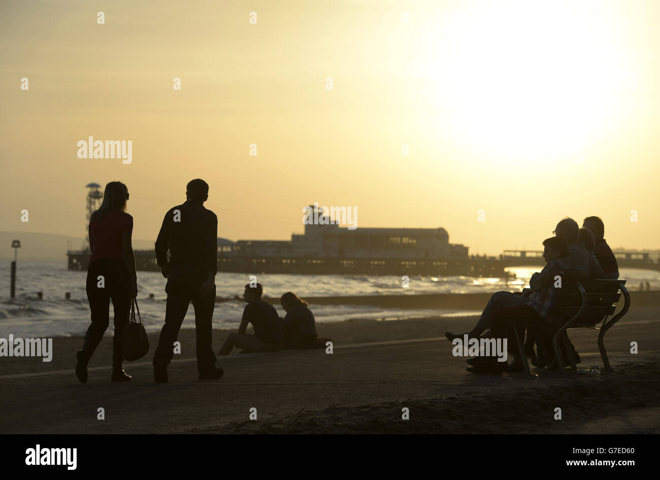 People enjoy the sunset at Bournemouth beach, Dorset, as Britain has ...