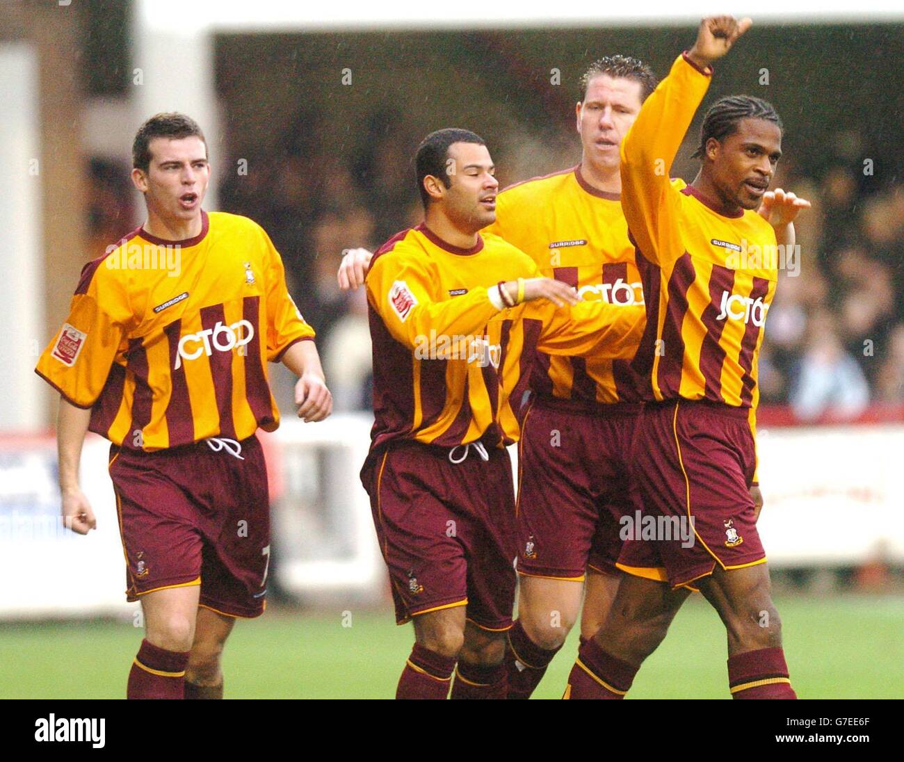 Zema Abbey of Bradford City is congratulated by teammates after scoring ...