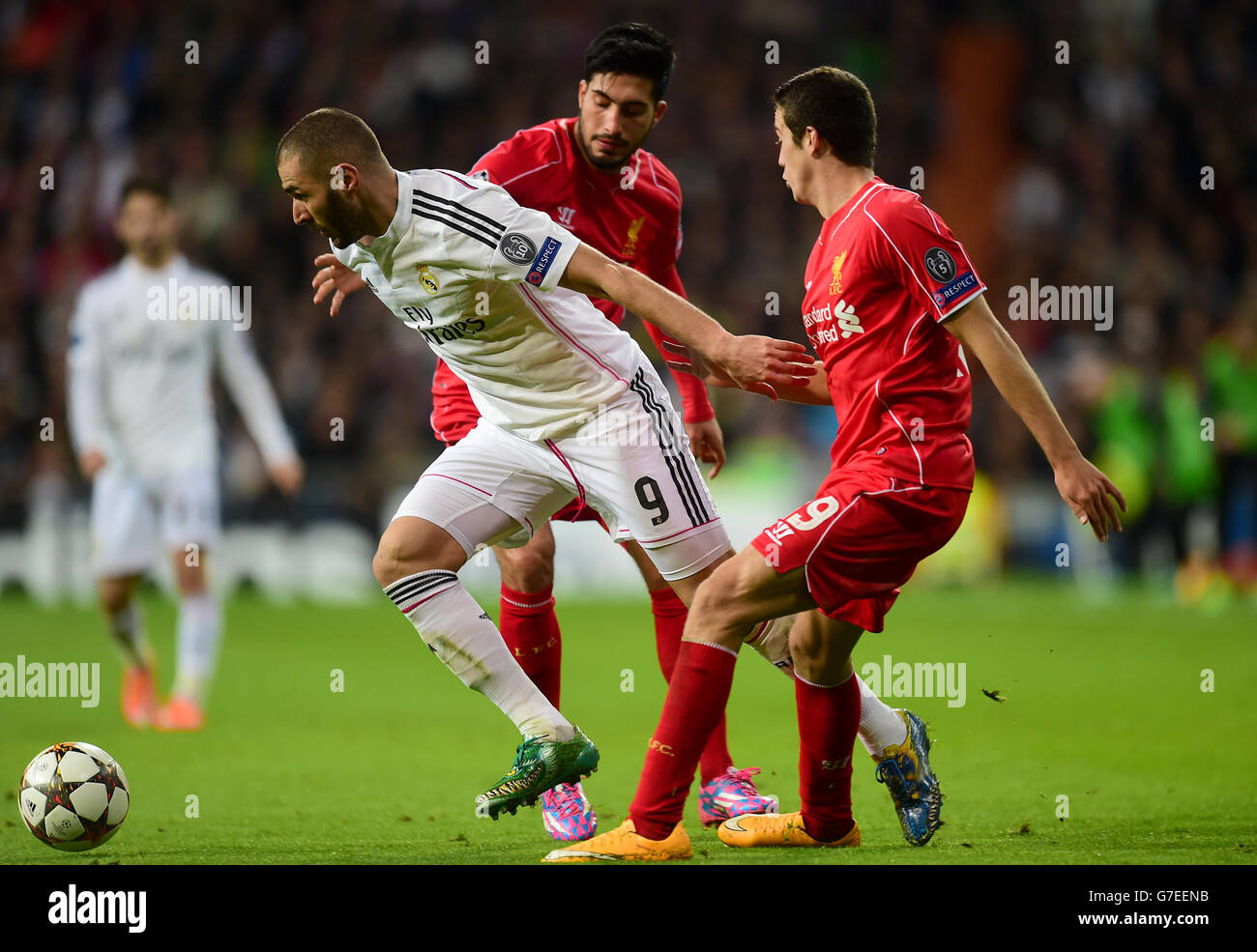Real Madrid's Karim Benzema (left) in action with Liverpool's Emre Can ...