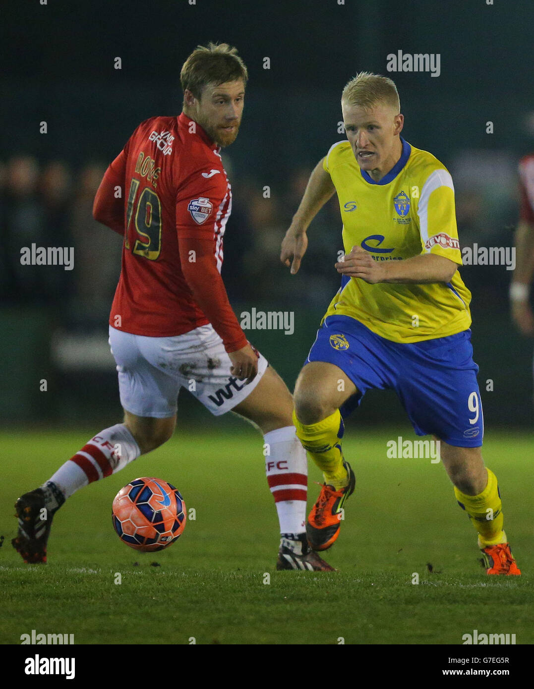 Warrington Town's Ben Wharton gets past Exeter City's David Noble ...